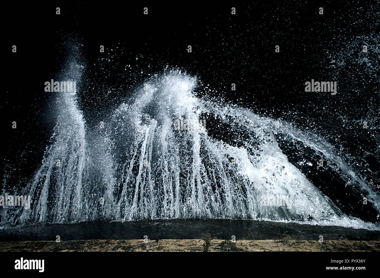 Splashing wave on the Black sea in the night Stock Photo - Alamy