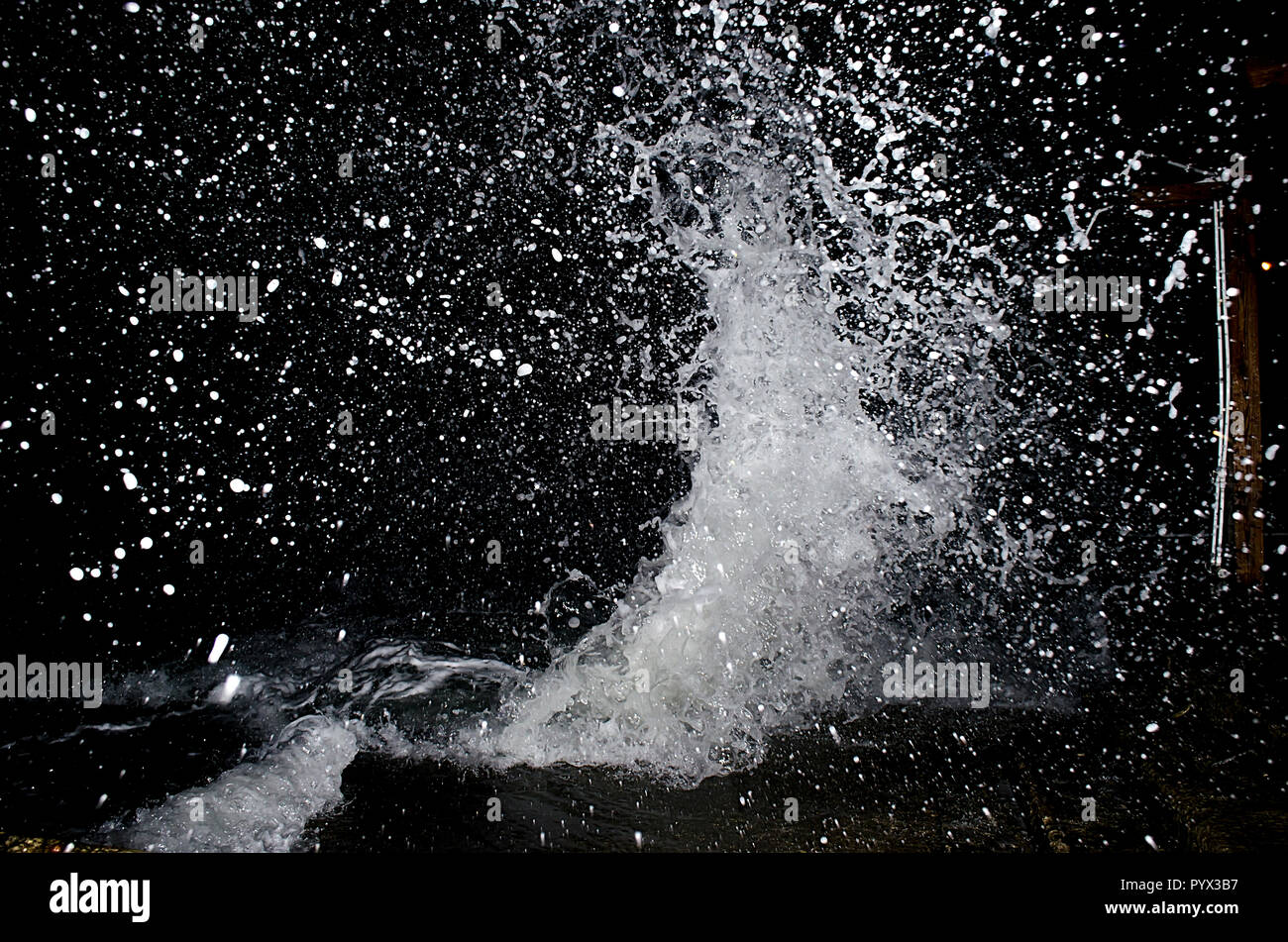 Splashing wave on the Black sea in the night Stock Photo - Alamy