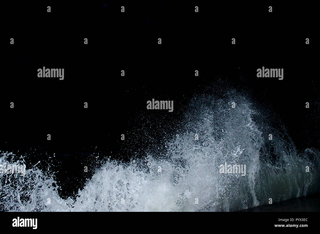 Splashing wave on the Black sea in the night Stock Photo - Alamy