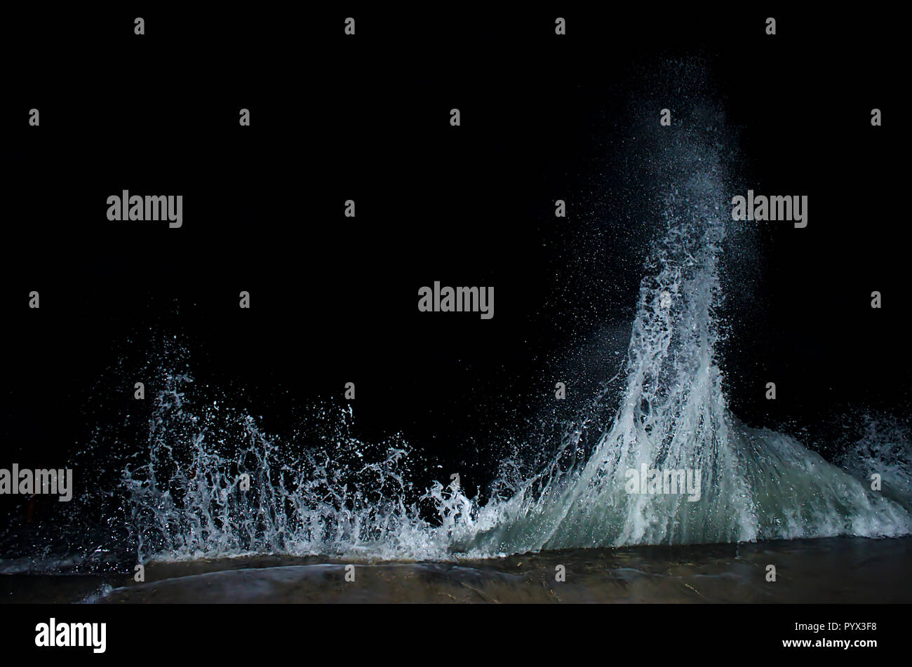 Splashing wave on the Black sea in the night Stock Photo - Alamy