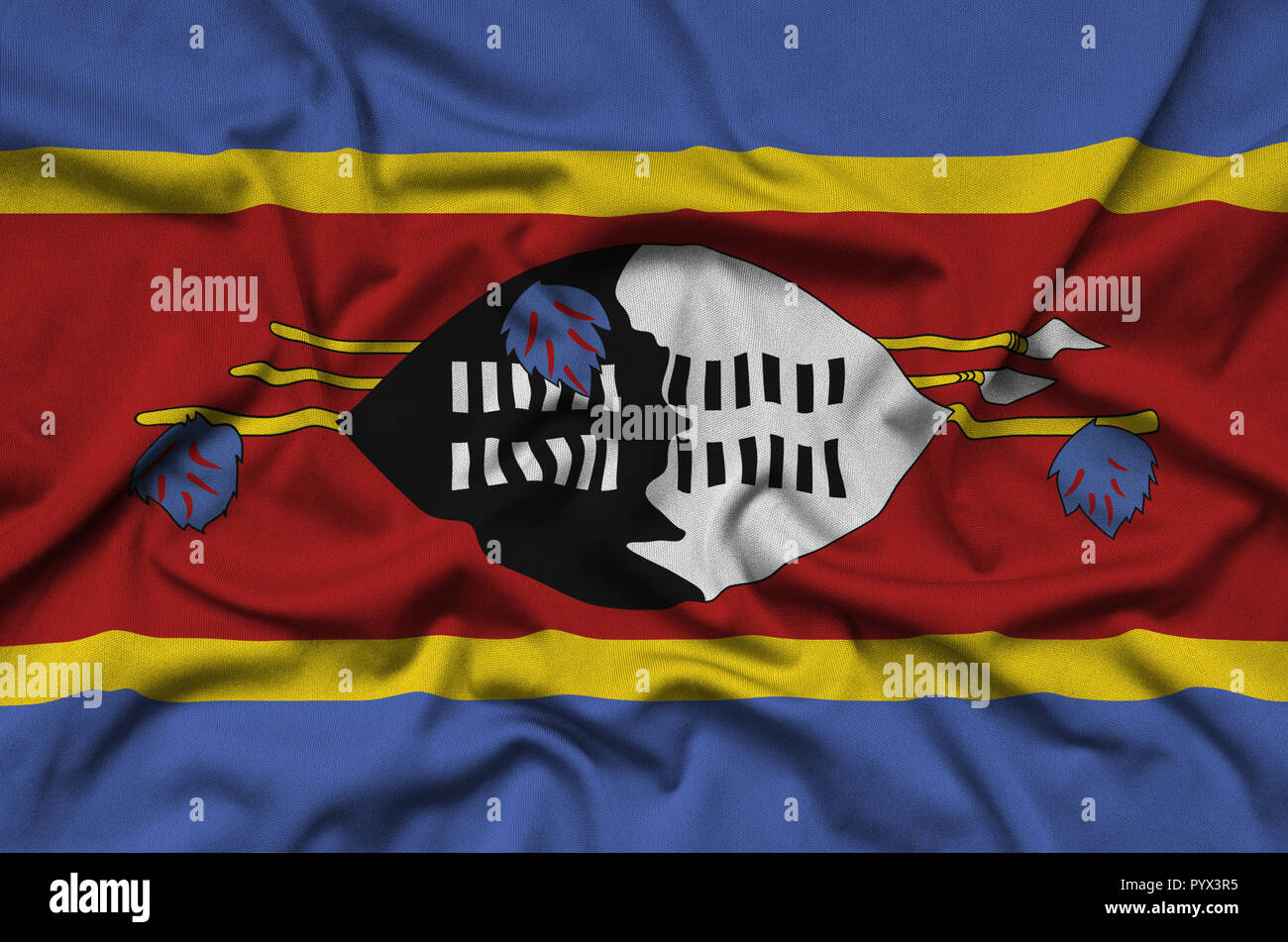 Swaziland flag is depicted on a sports cloth fabric with many folds ...