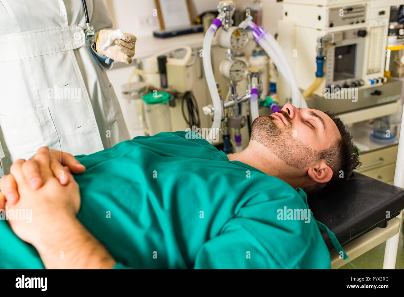 Patient lying on an operating table hi-res stock photography and images ...