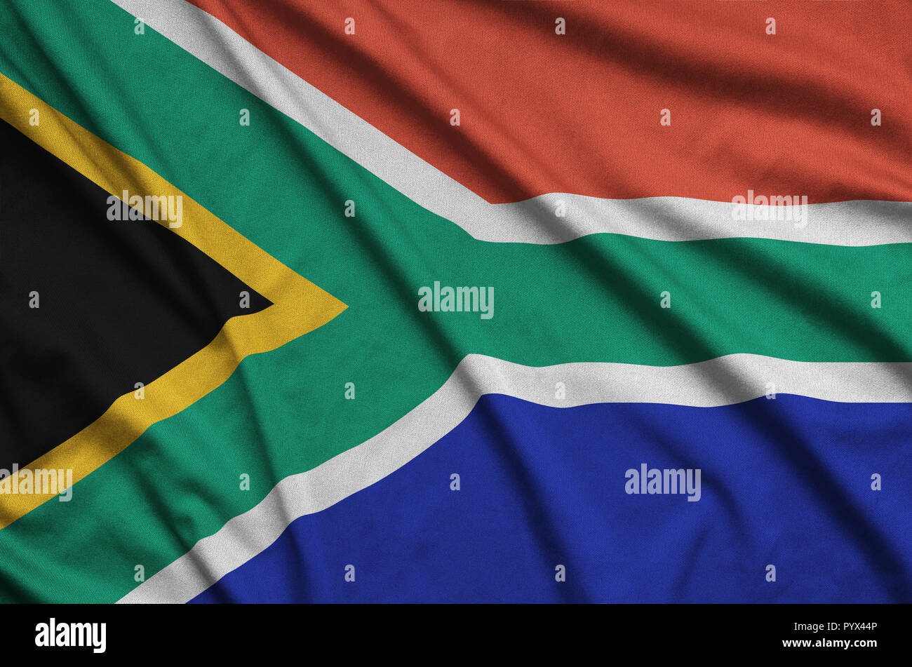 South Africa flag is depicted on a sports cloth fabric with many folds ...