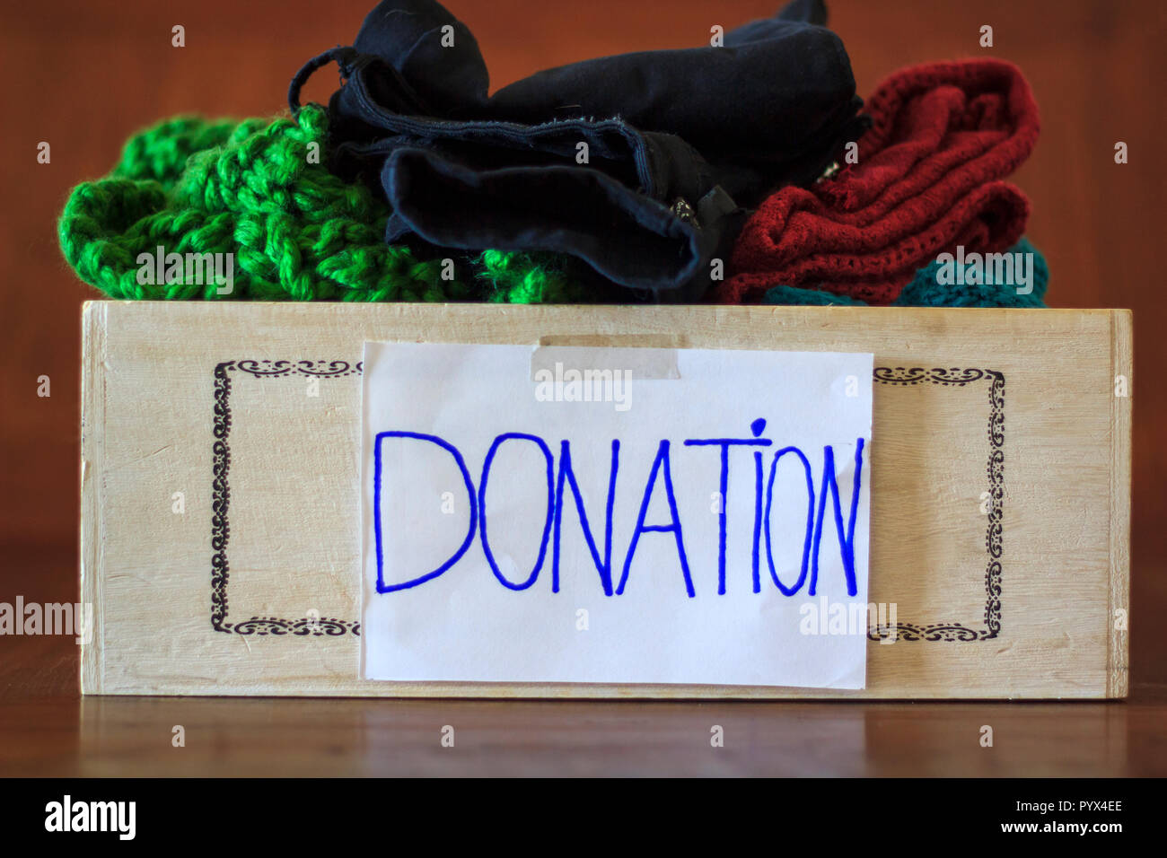 Box with clothes for donation Stock Photo - Alamy