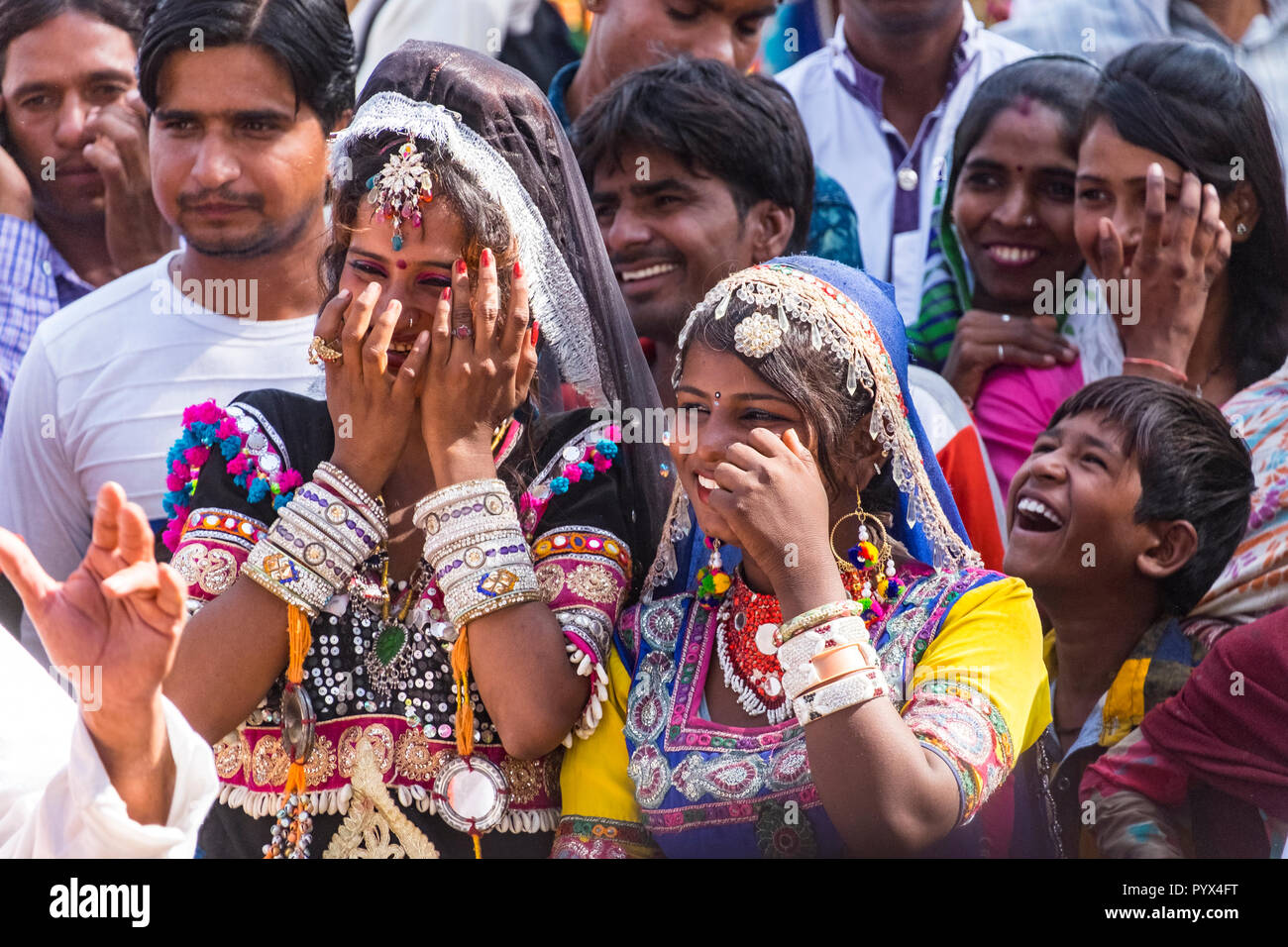Local dancers laughing at Pushkar camel fair in India Stock Photo - Alamy