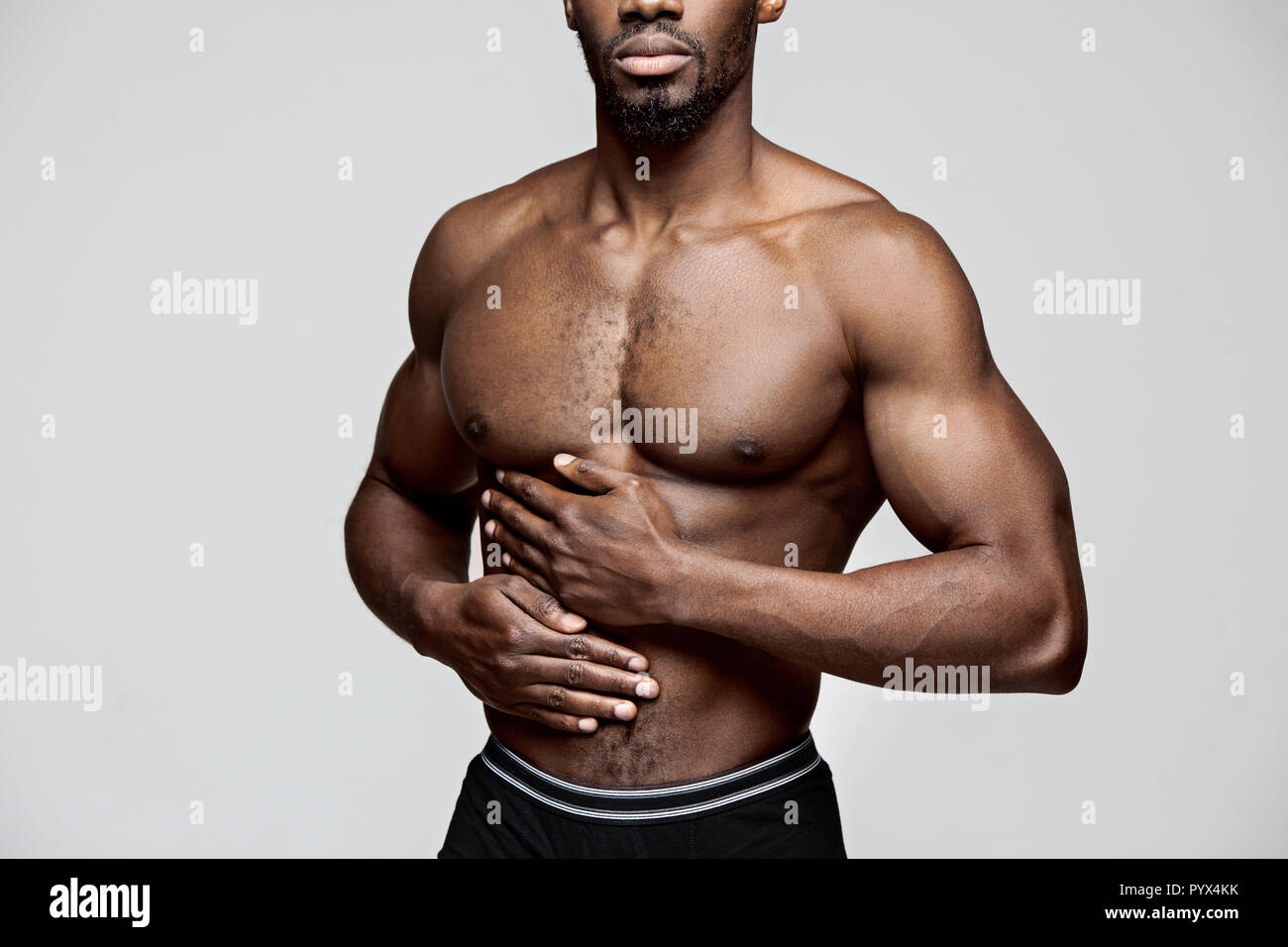 Pain concept. Beautiful male portrait isolated on pink backgroud. Young ...