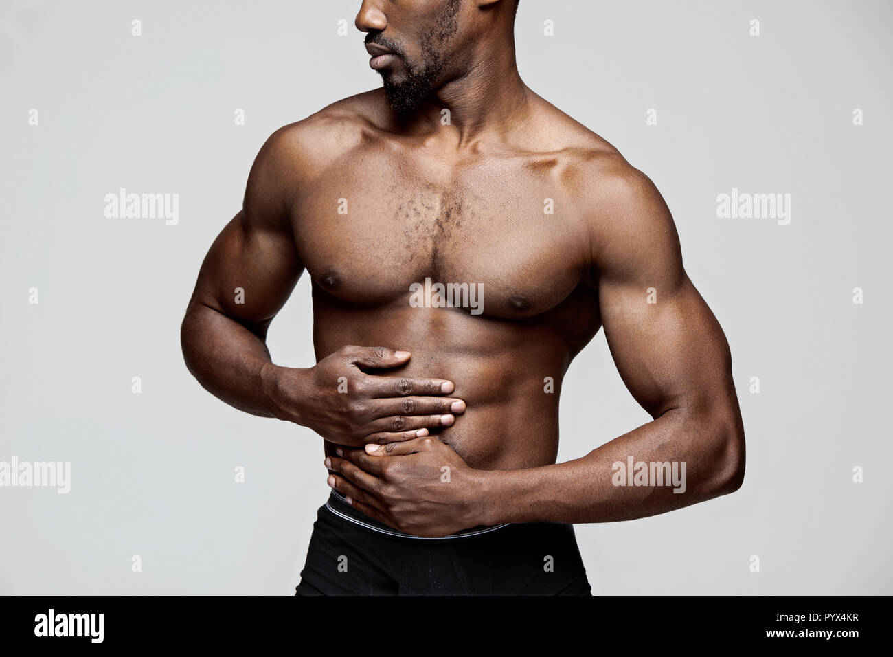 Pain concept. Beautiful male portrait isolated on pink backgroud. Young ...