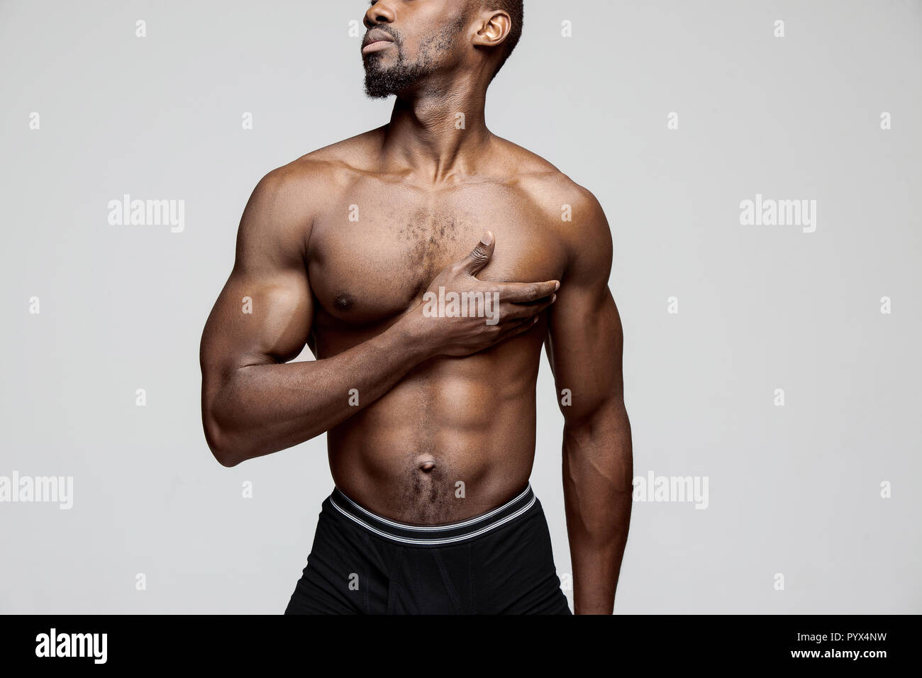 Young african american man having a pain in the heart. Heart attack ...