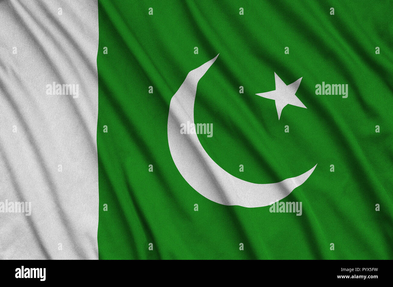 Pakistan flag is depicted on a sports cloth fabric with many folds ...