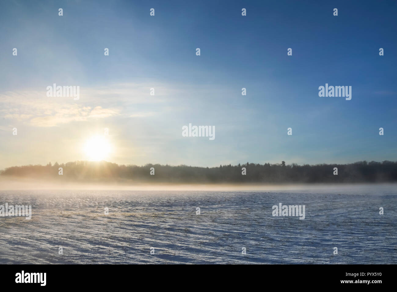 Sunrise over snow covered field hi-res stock photography and images - Alamy