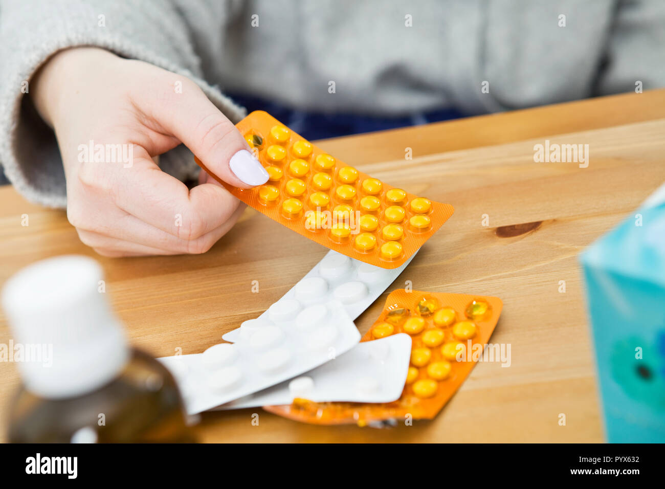 A lot of medicines on night table in bedroom. Woman taking pills Stock ...