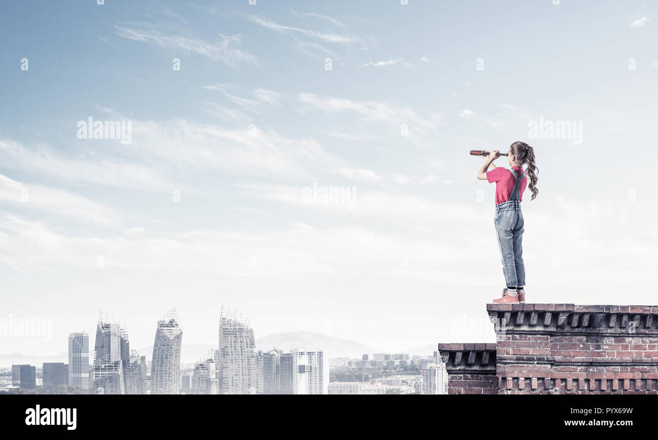 Concept of careless happy childhood with girl exploring this wor Stock ...