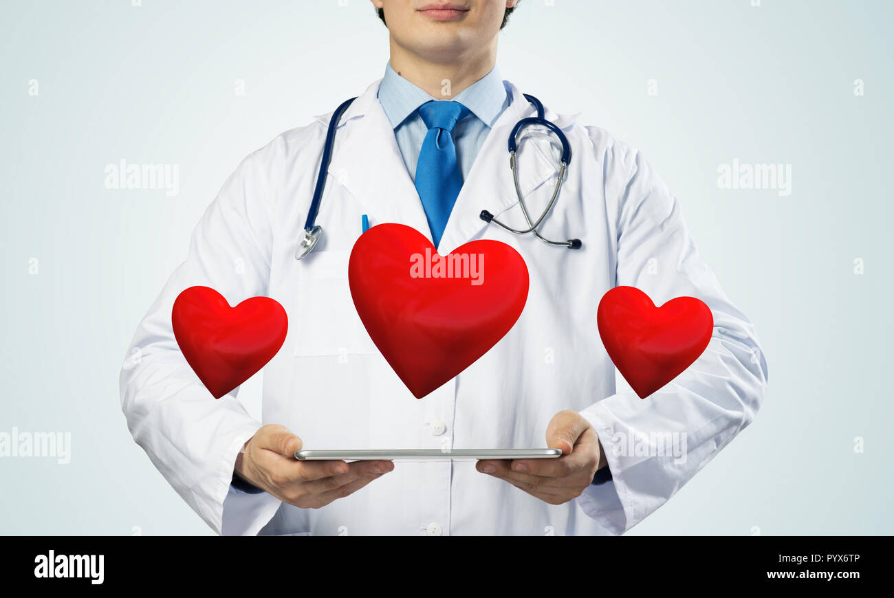 Doctor cares about heart health Stock Photo - Alamy