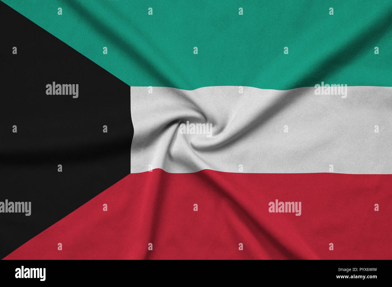 Kuwait flag is depicted on a sports cloth fabric with many folds. Sport ...