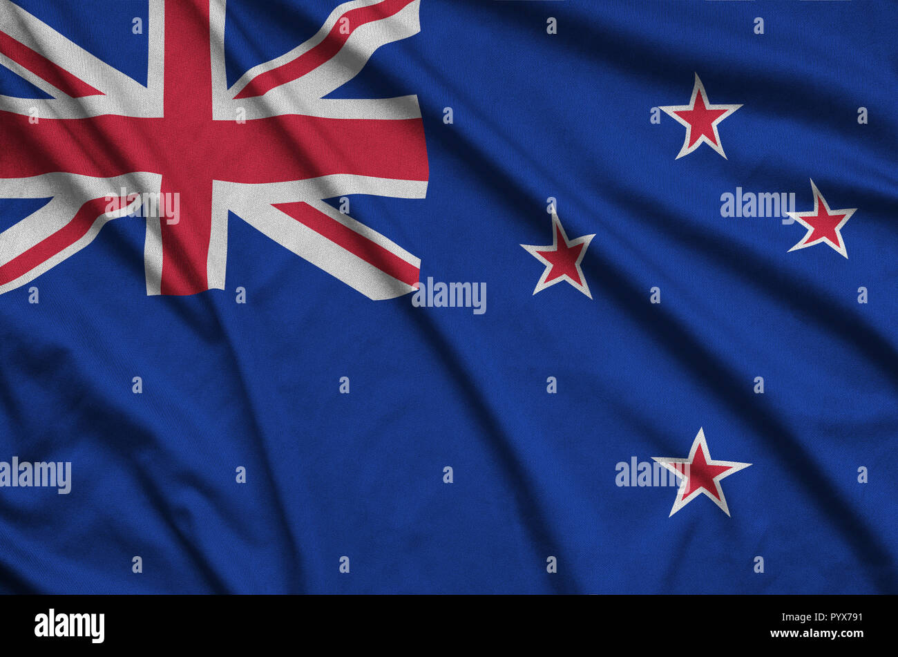 New Zealand flag is depicted on a sports cloth fabric with many folds ...