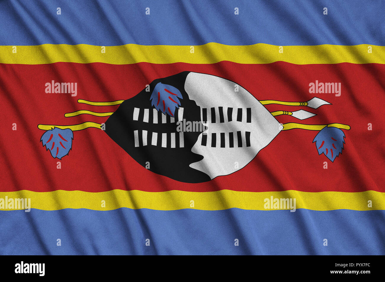 Swaziland flag is depicted on a sports cloth fabric with many folds ...