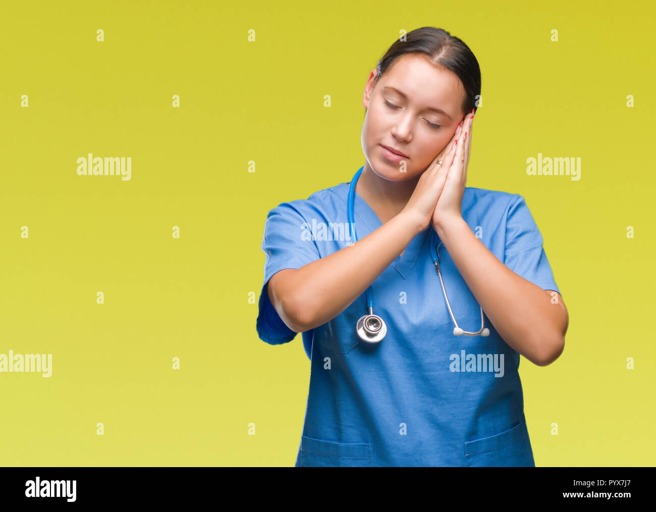 Young caucasian doctor woman wearing medical uniform over isolated ...