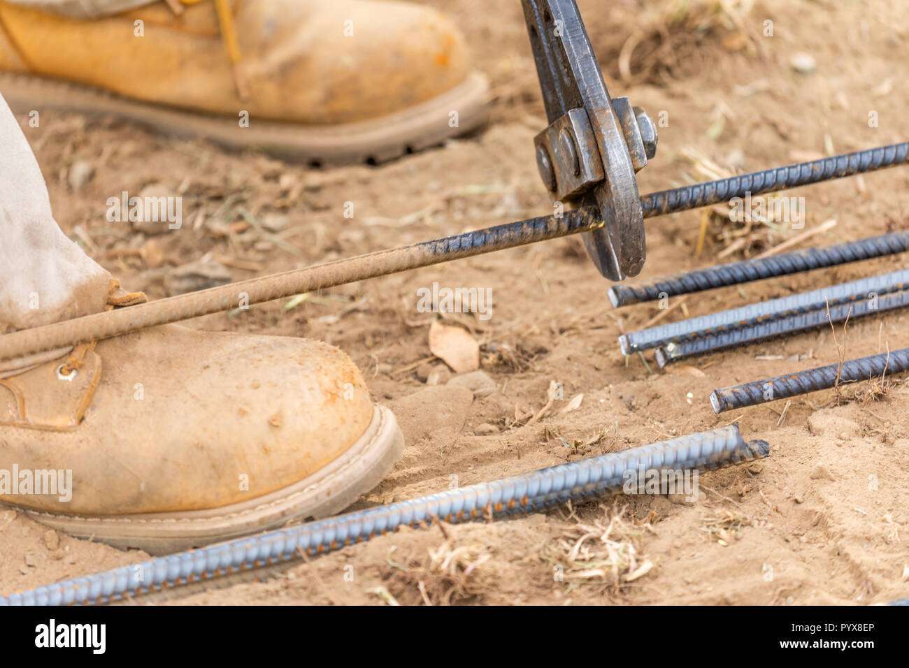 Worker Cutting Steel Rebar At Construction Site Abstract Stock Photo ...