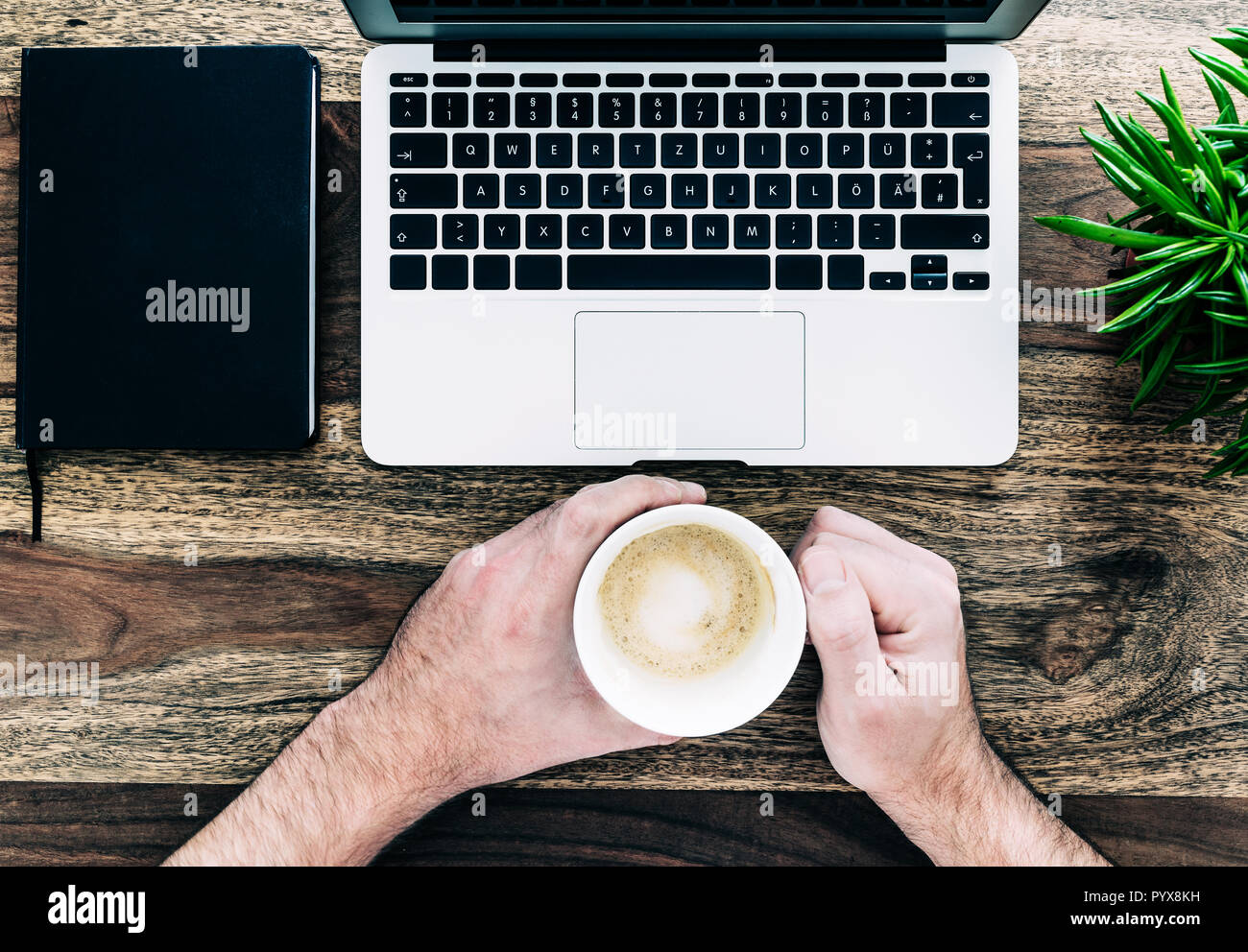 man drinking coffee in front of laptop computer Stock Photo - Alamy