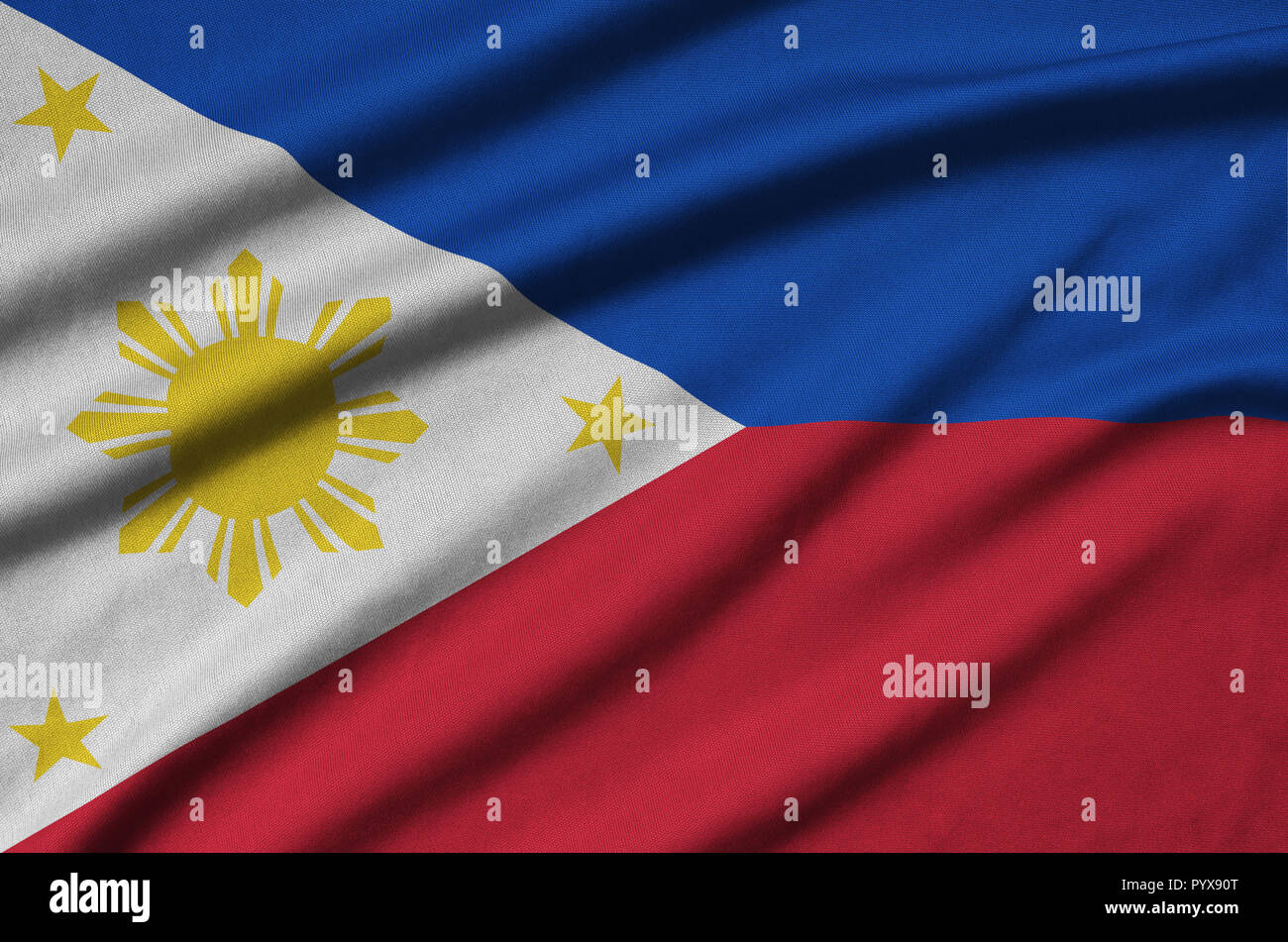 Philippines flag is depicted on a sports cloth fabric with many folds ...