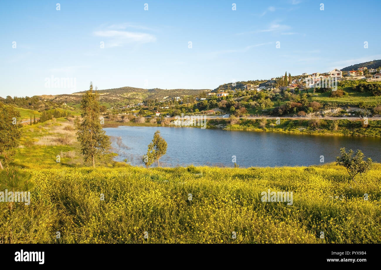 Cyprus landscape with mountains, lake and village Stock Photo - Alamy
