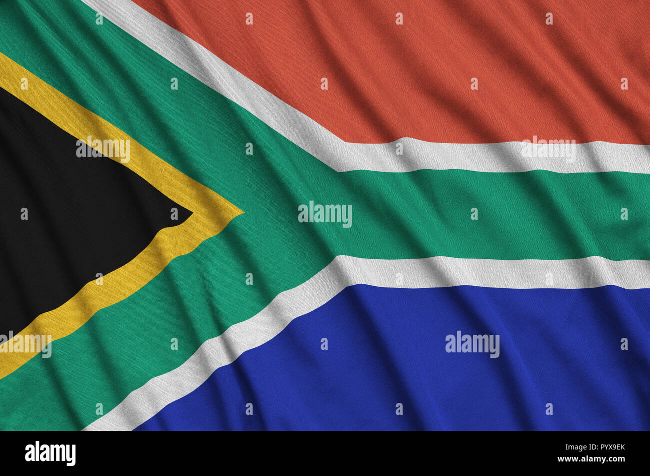 South Africa flag is depicted on a sports cloth fabric with many folds ...