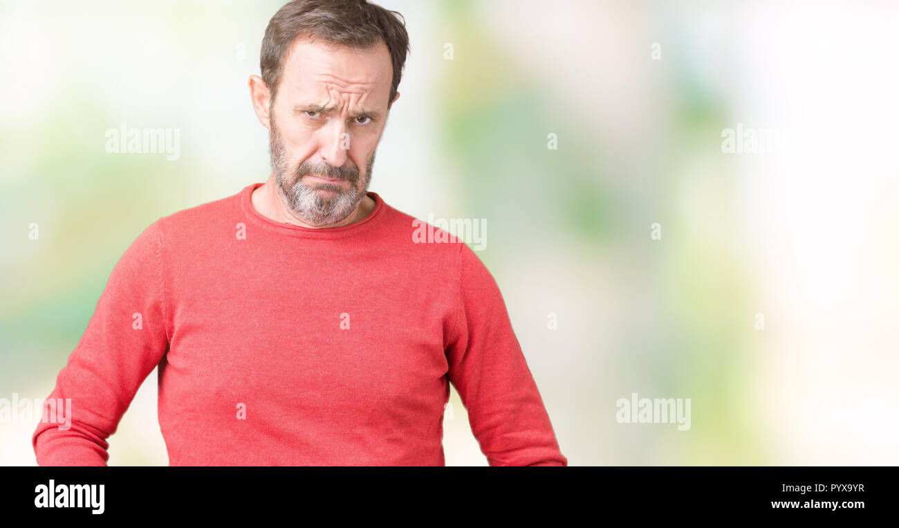 Handsome middle age hoary senior man wearing winter sweater over ...