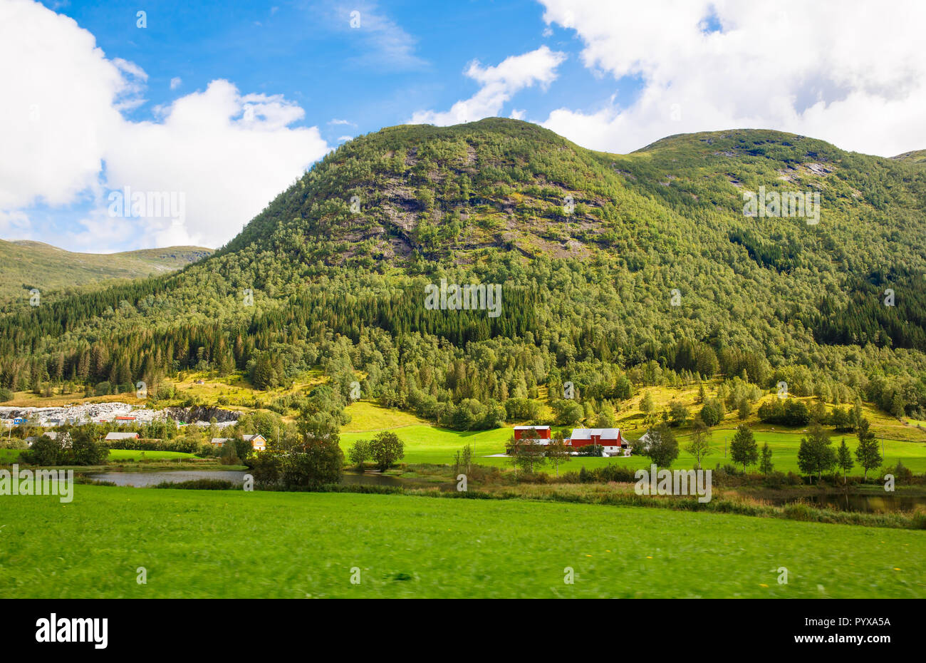 Landscape with village houses and mountain in Norway Stock Photo - Alamy