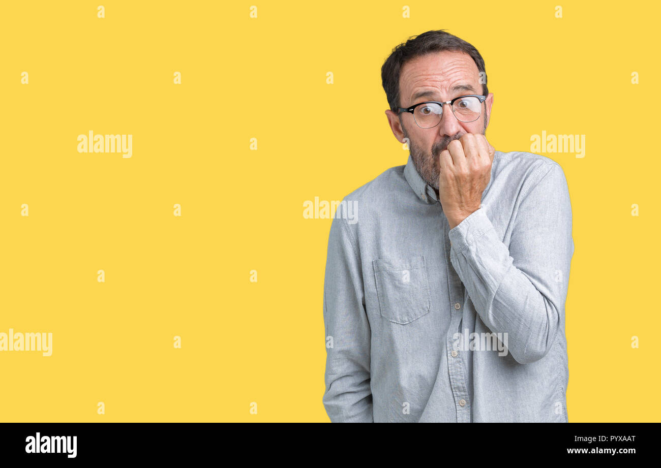 Handsome middle age elegant senior man wearing glasses over isolated ...