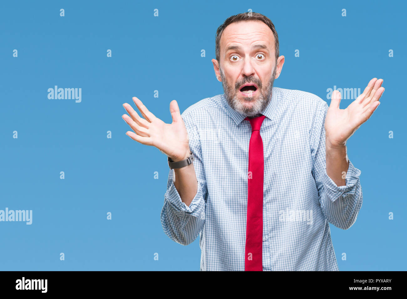 Middle age hoary senior business man wearing red tie over isolated ...