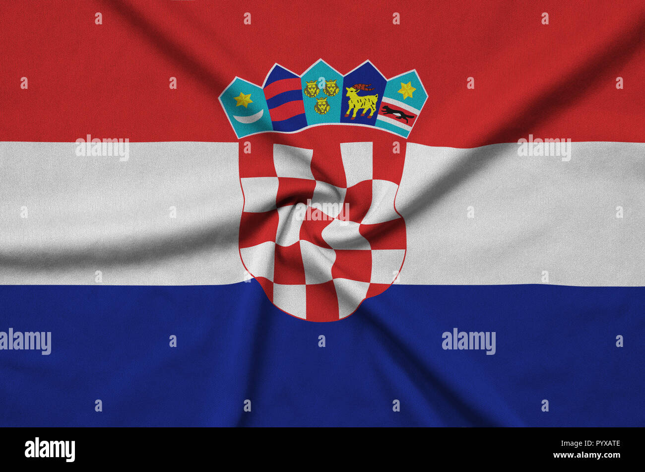 Croatia flag is depicted on a sports cloth fabric with many folds ...