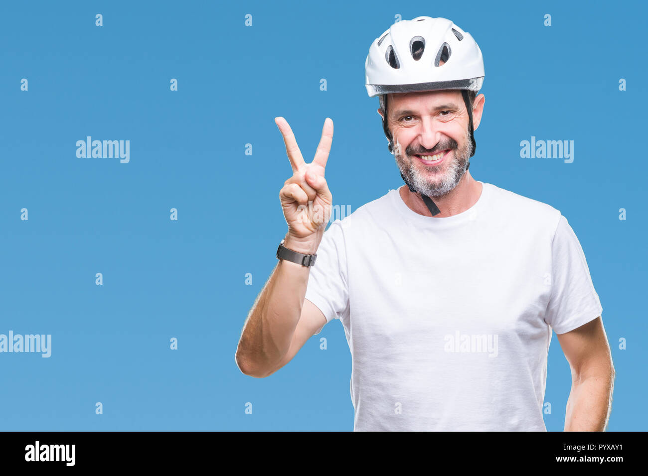 Middle age senior hoary cyclist man wearing bike safety helment ...