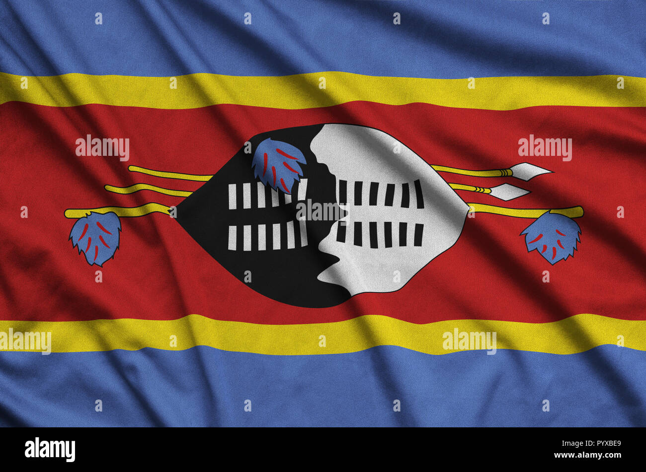 Swaziland flag is depicted on a sports cloth fabric with many folds ...