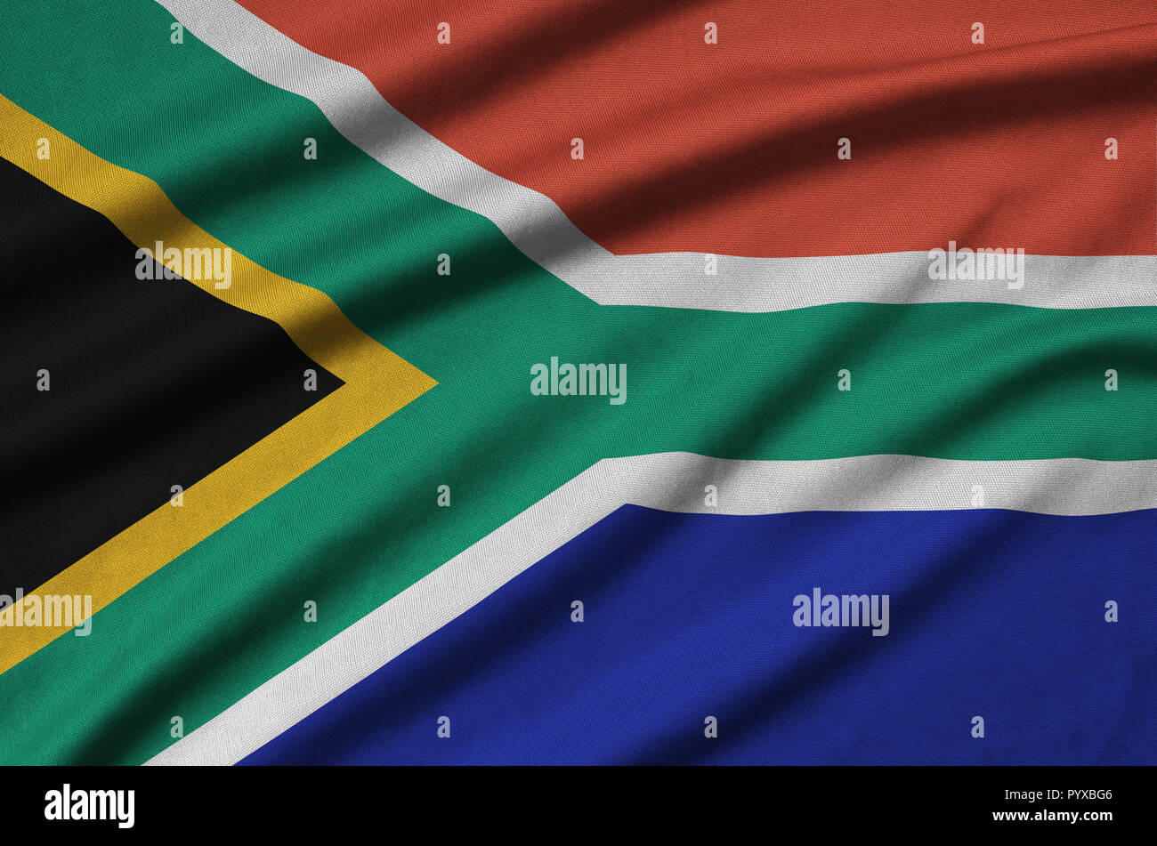 South Africa flag is depicted on a sports cloth fabric with many folds ...