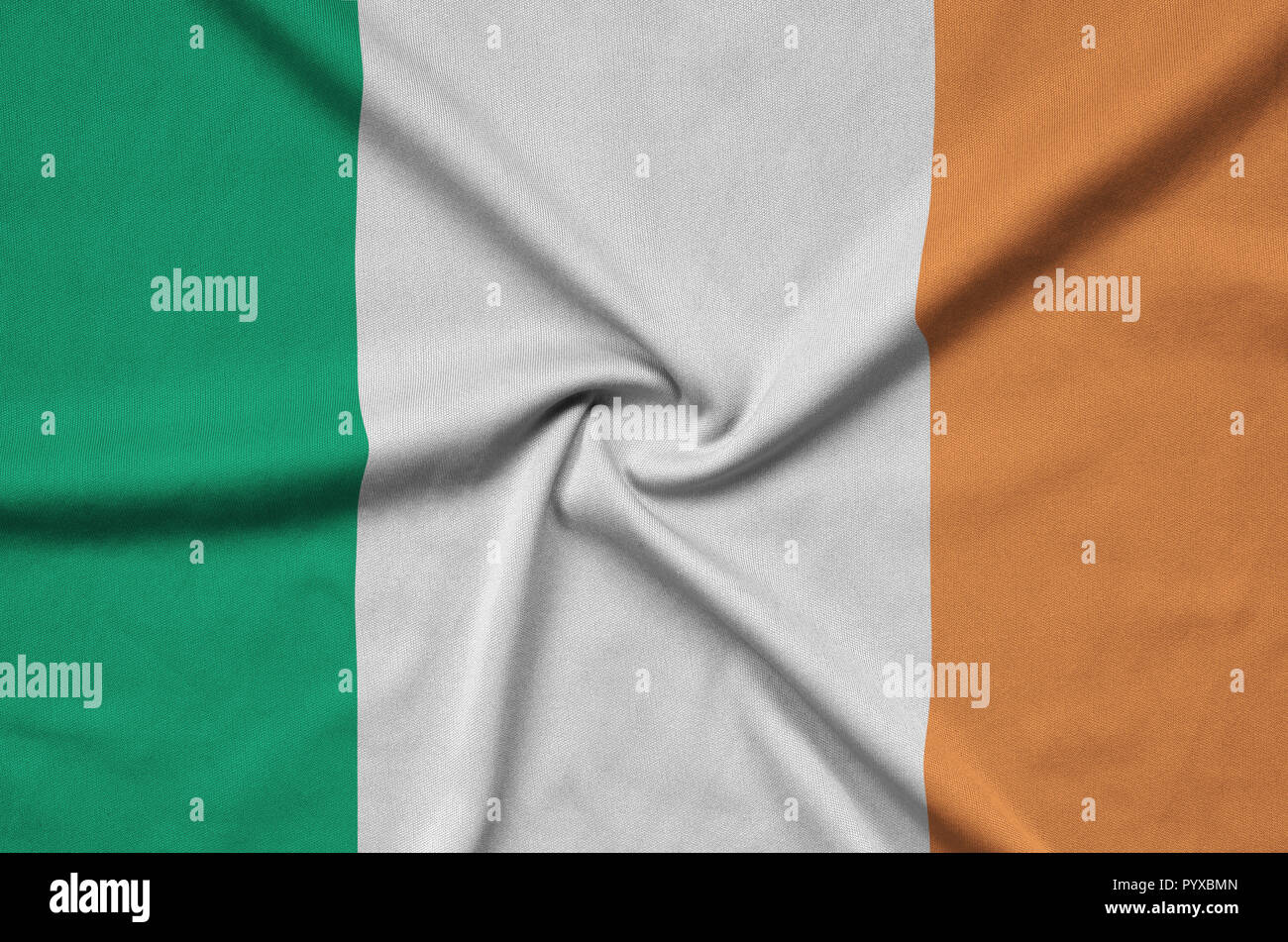 Ireland flag is depicted on a sports cloth fabric with many folds ...