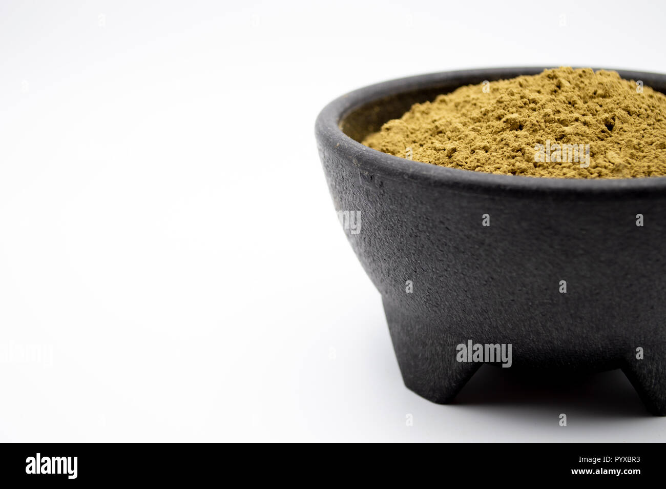 Bulk Kratom powder in a black bowl isolated on a white background Stock ...