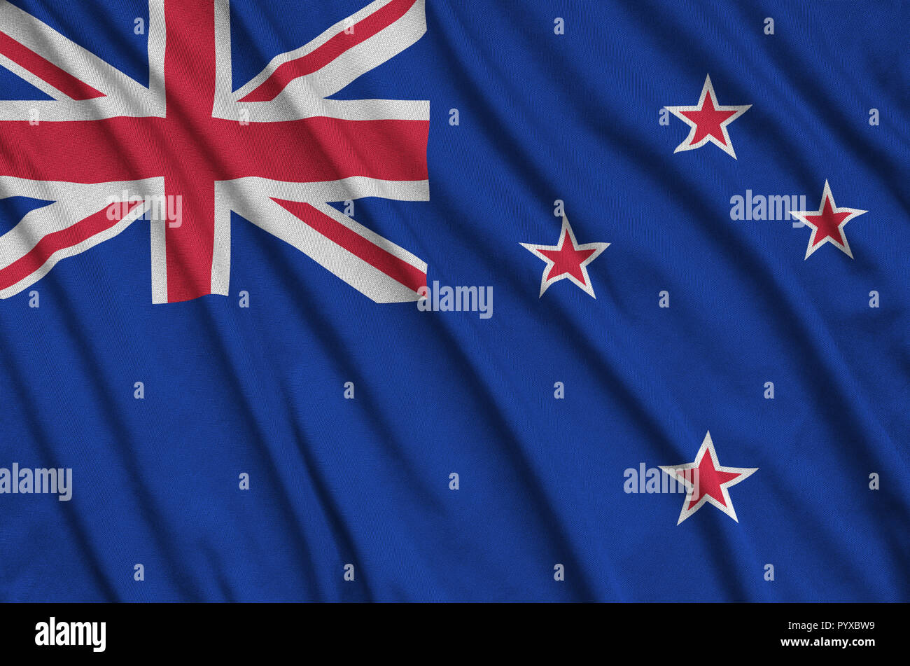 New Zealand flag is depicted on a sports cloth fabric with many folds ...