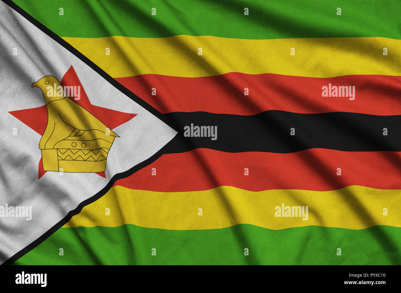 Zimbabwe flag is depicted on a sports cloth fabric with many folds ...