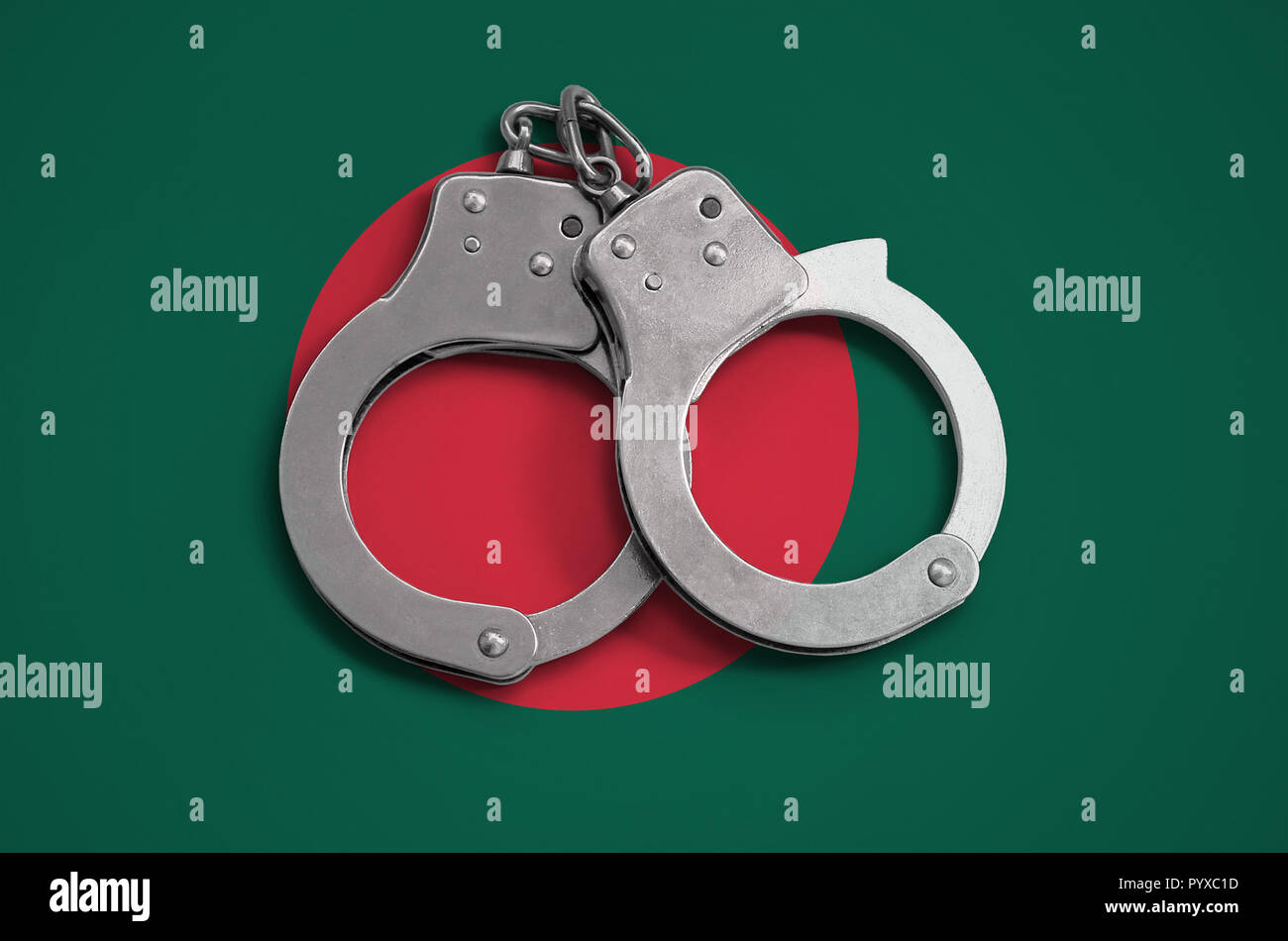 Bangladesh flag and police handcuffs. The concept of observance of the ...