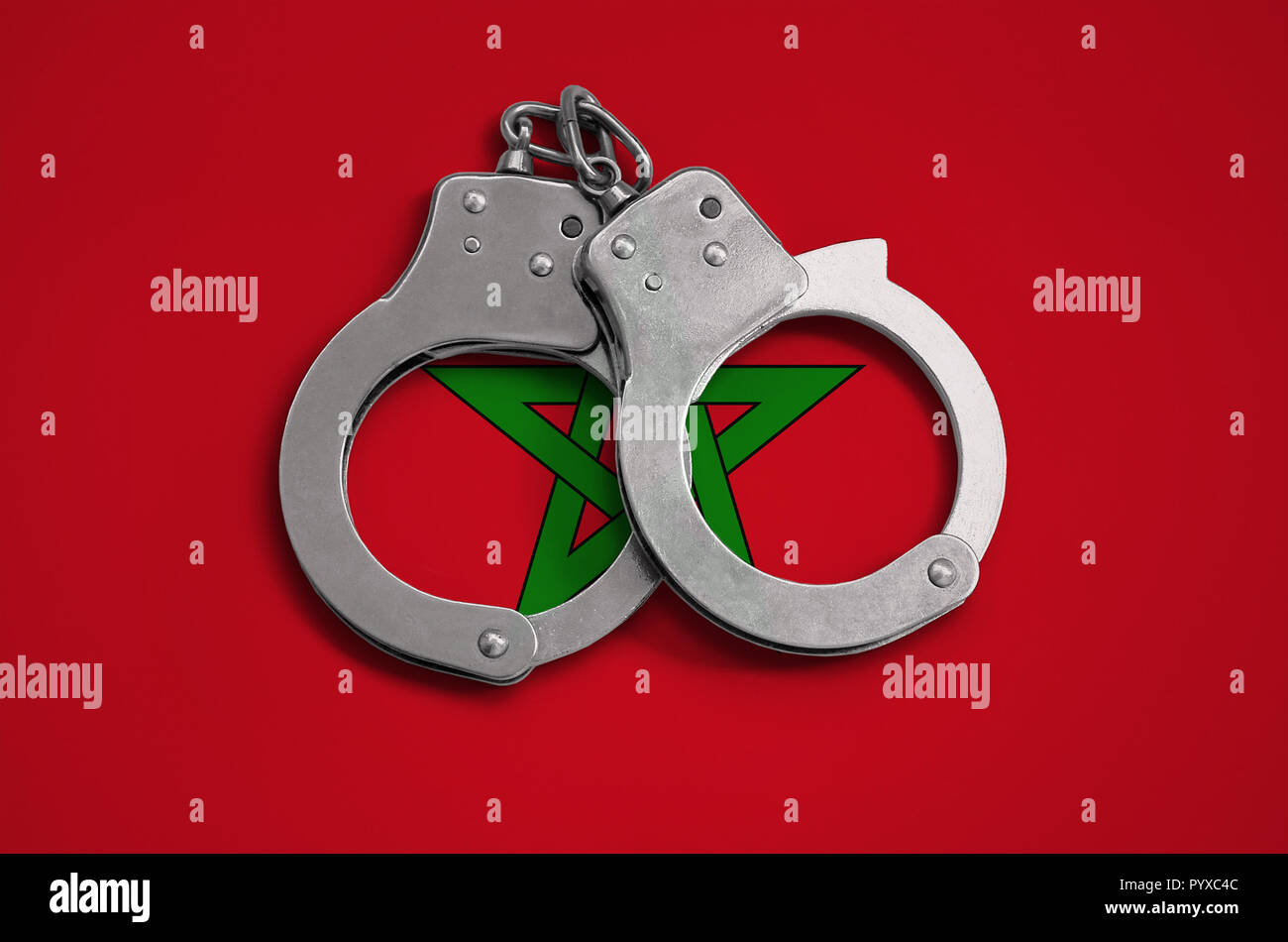 Morocco flag and police handcuffs. The concept of observance of the law ...