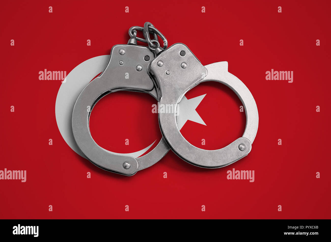 Turkey flag and police handcuffs. The concept of observance of the law ...
