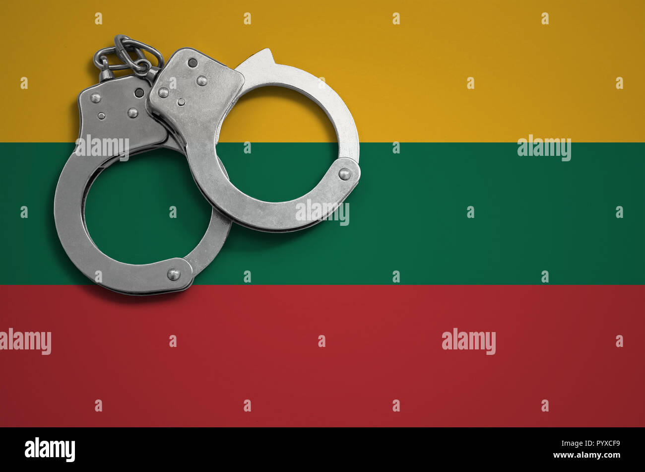 Lithuania flag and police handcuffs. The concept of crime and offenses ...