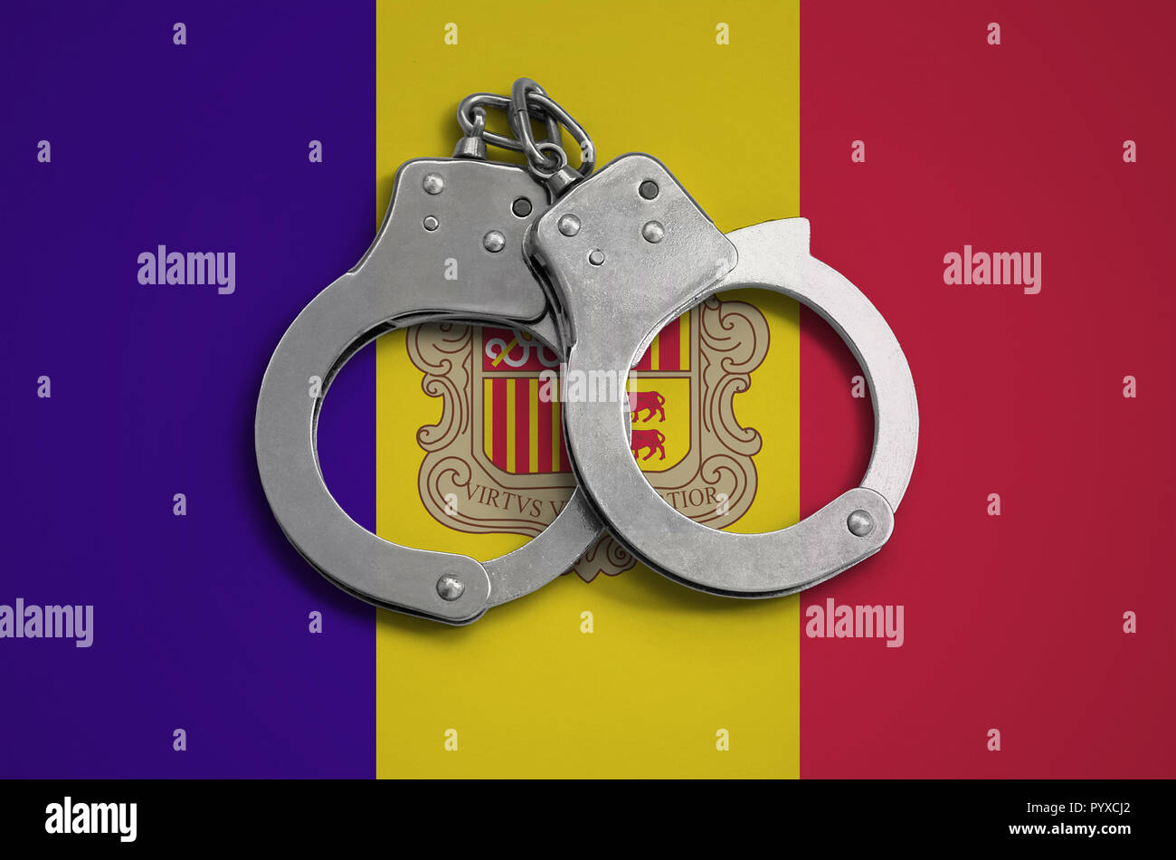 Andorra flag and police handcuffs. The concept of observance of the law ...