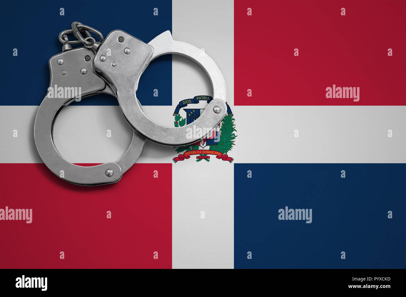Dominican Republic flag and police handcuffs. The concept of crime and ...