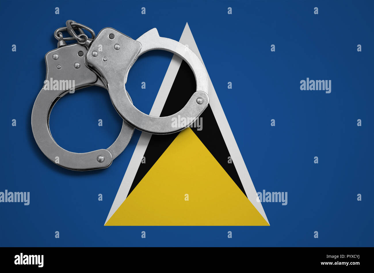 Saint Lucia flag and police handcuffs. The concept of crime and ...