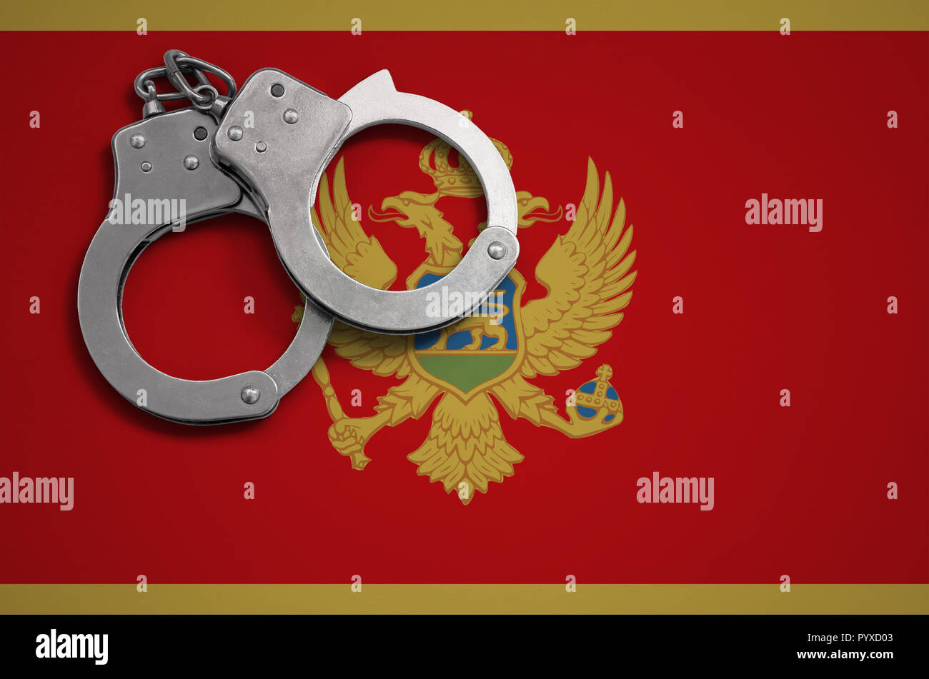 Montenegro flag and police handcuffs. The concept of crime and offenses ...