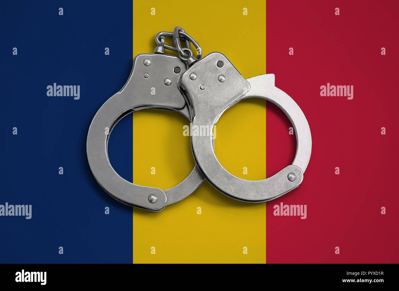 Chad flag and police handcuffs. The concept of observance of the law in ...