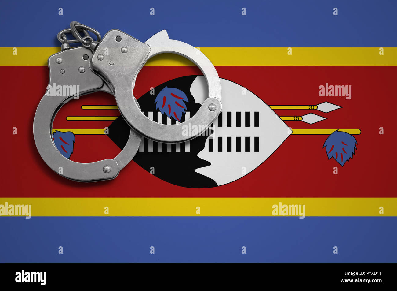 Swaziland flag and police handcuffs. The concept of crime and offenses ...