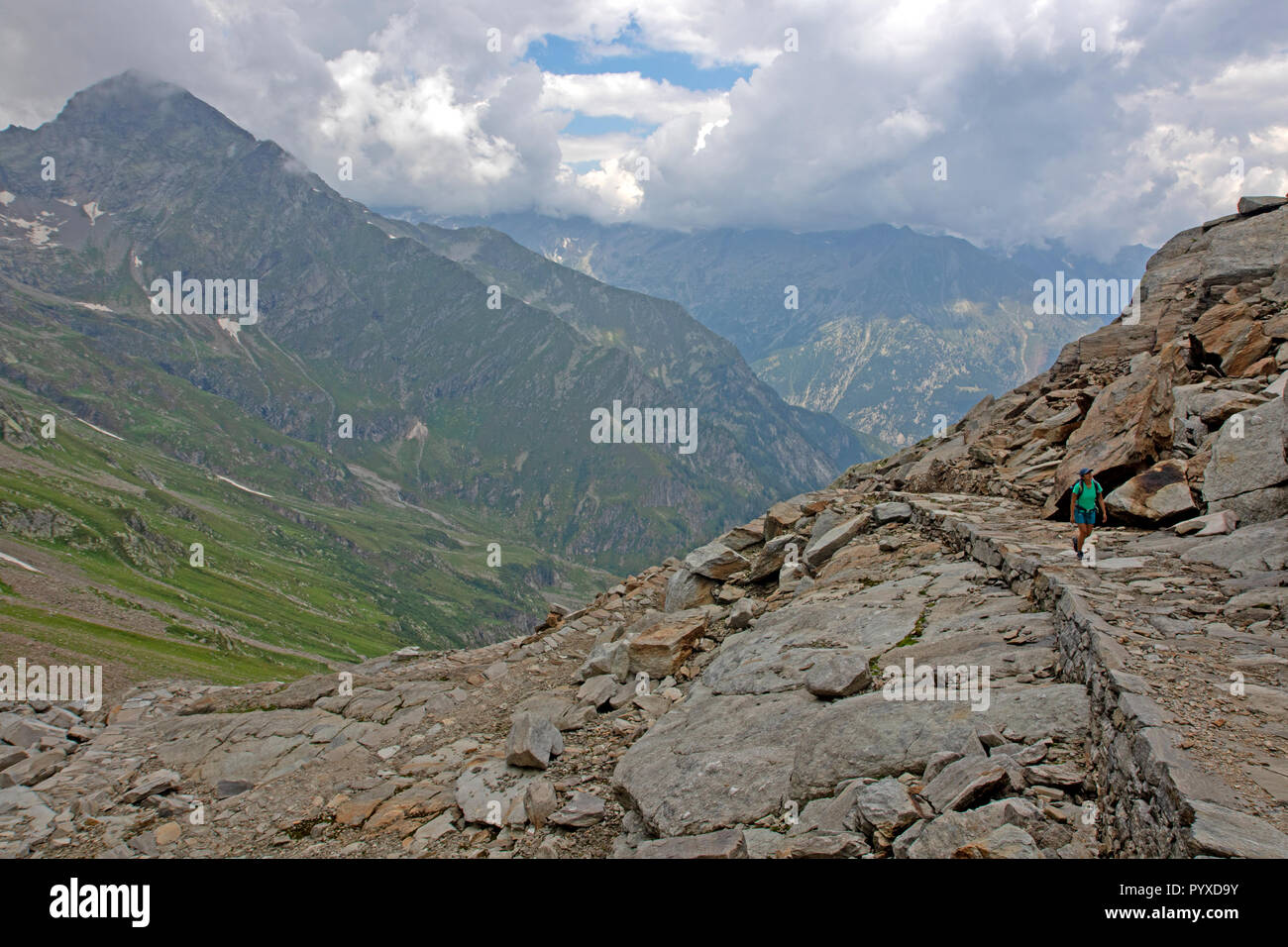 Hiker climbing towards Colle del Turlo on the Tour de Monte Rosa Stock ...