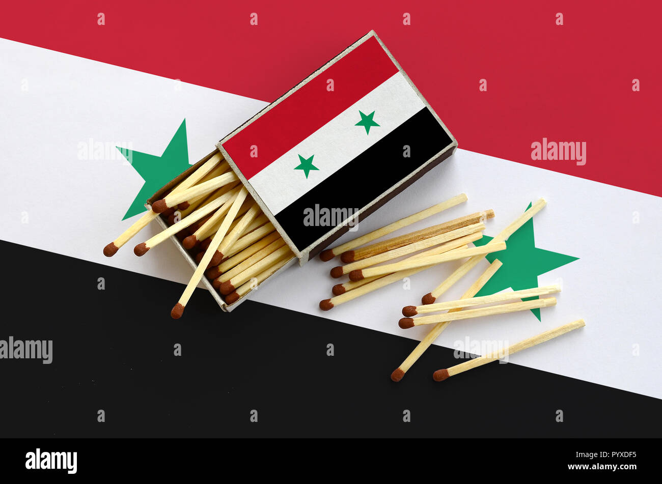 Syria flag is shown on an open matchbox hi-res stock photography and ...